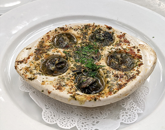 Escargot that could convert the skeptics – these garlicky, herb-butter bathed beauties aren't just snails, they're little vessels of French culinary tradition done absolutely right.