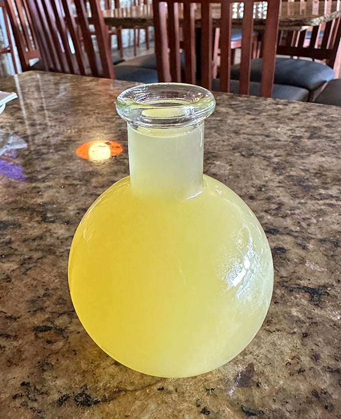 The honey wine arrives in its own little glass universe. Clear, golden, and potent—like liquid sunshine with a mischievous kick.