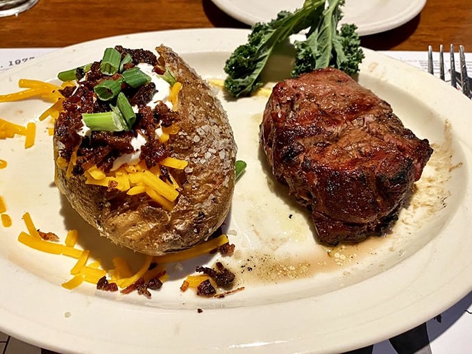 The perfect partnership: a juicy filet mignon alongside a loaded baked potato that's dressed for its own special occasion.