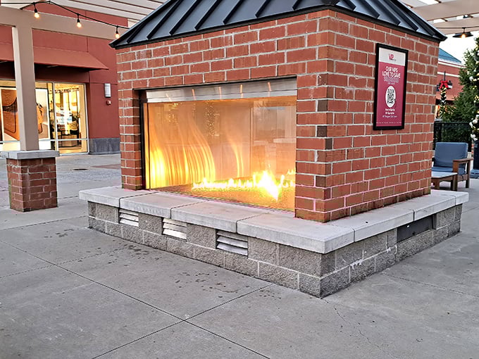 The outdoor fireplace creates a cozy gathering spot for shoppers comparing their treasures. "I got this cashmere sweater for the price of a pizza!"