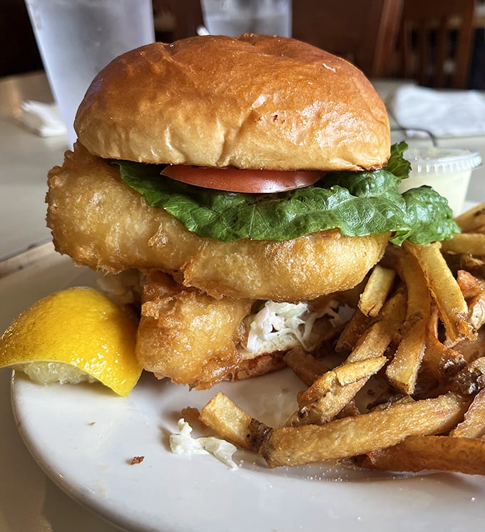 A fish sandwich that requires both hands and a strategy. The golden-fried fillets practically high-five your taste buds with each magnificent bite.