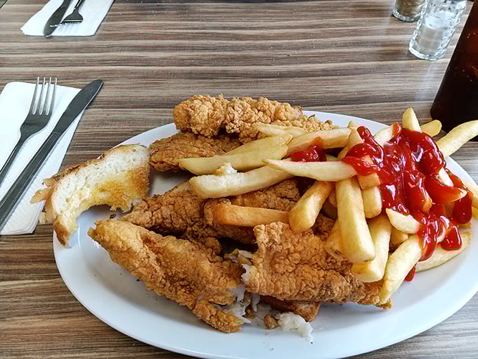 Crispy on the outside, tender on the inside—this fish and chips plate doesn't need a passport to transport you to comfort food nirvana.