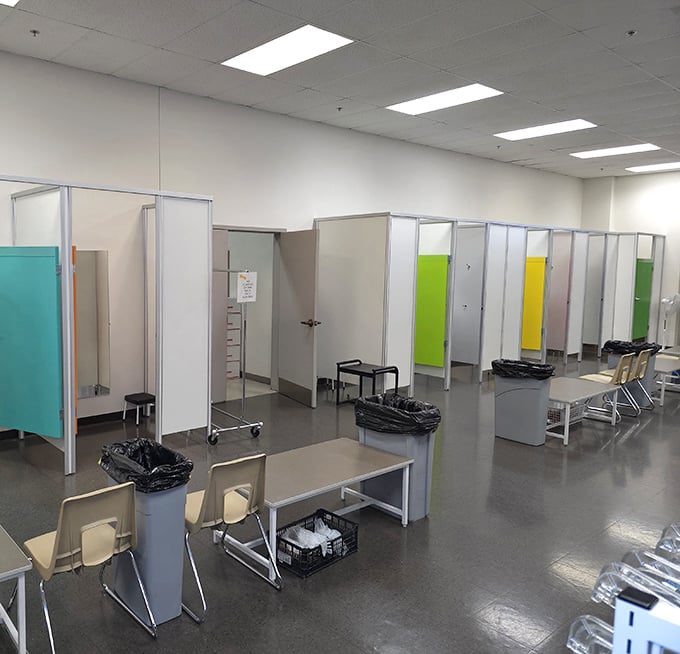 The fitting rooms—surprisingly spacious and color-coded—where fashion dreams either come true or get respectfully returned to the rack.