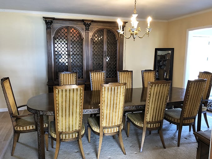 Imagine the dinner parties this elegant dining set has hosted—decades of holiday meals, spirited debates, and family announcements all absorbed into its polished wood.