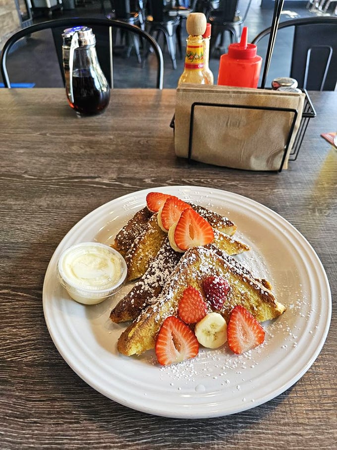 French toast that makes you understand why the French are so smug about food. Those strawberries aren't garnish—they're supporting actors in a breakfast blockbuster.