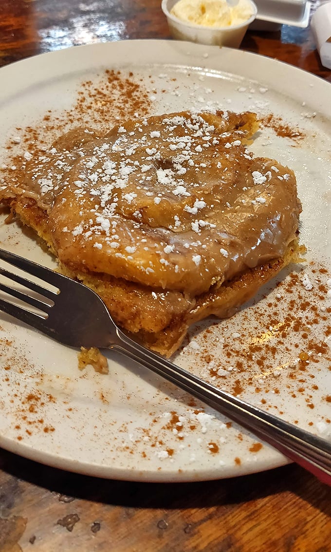 French toast that's having an identity crisis as dessert – cinnamon-dusted, powdered sugar-crowned, and utterly irresistible.