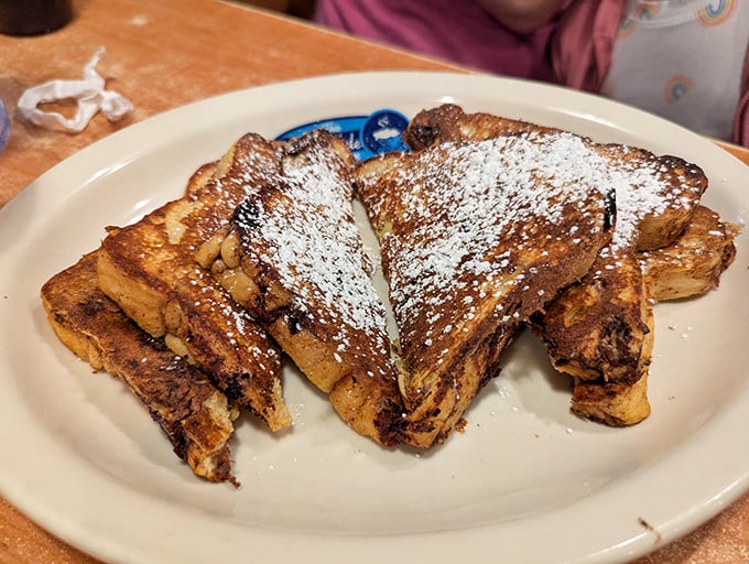 French toast that makes you question all other breakfast decisions. Dusted with powdered sugar and stacked like delicious dominoes waiting to fall.