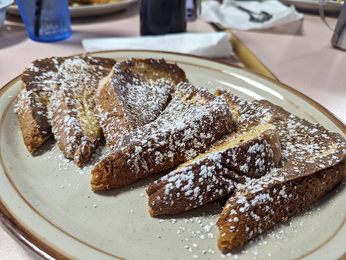 French toast dusted with enough powdered sugar to make Willy Wonka jealous – breakfast or dessert? Who cares?