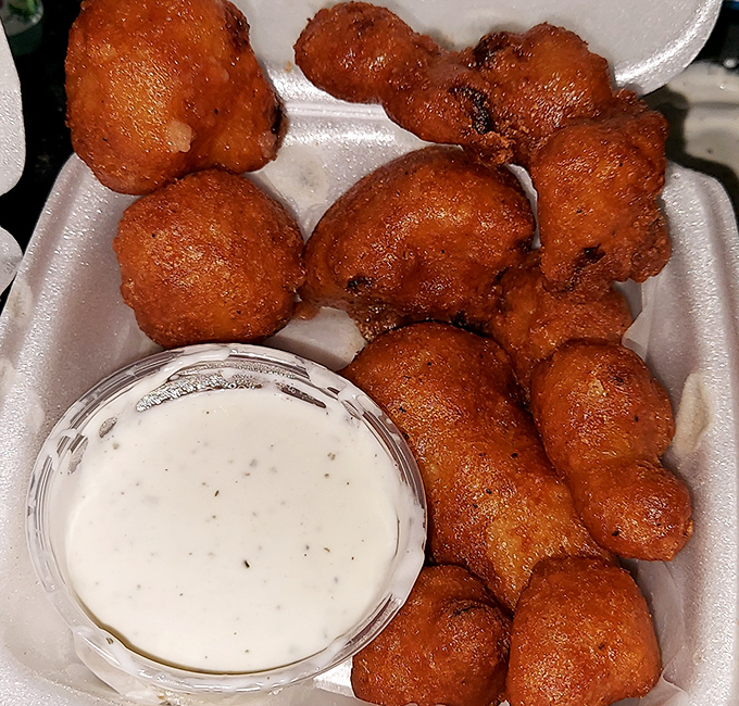 Fried cauliflower: where vegetable virtue meets deep-fried vice. That ranch dip isn't fooling anyone—this is comfort food wearing a health food disguise.
