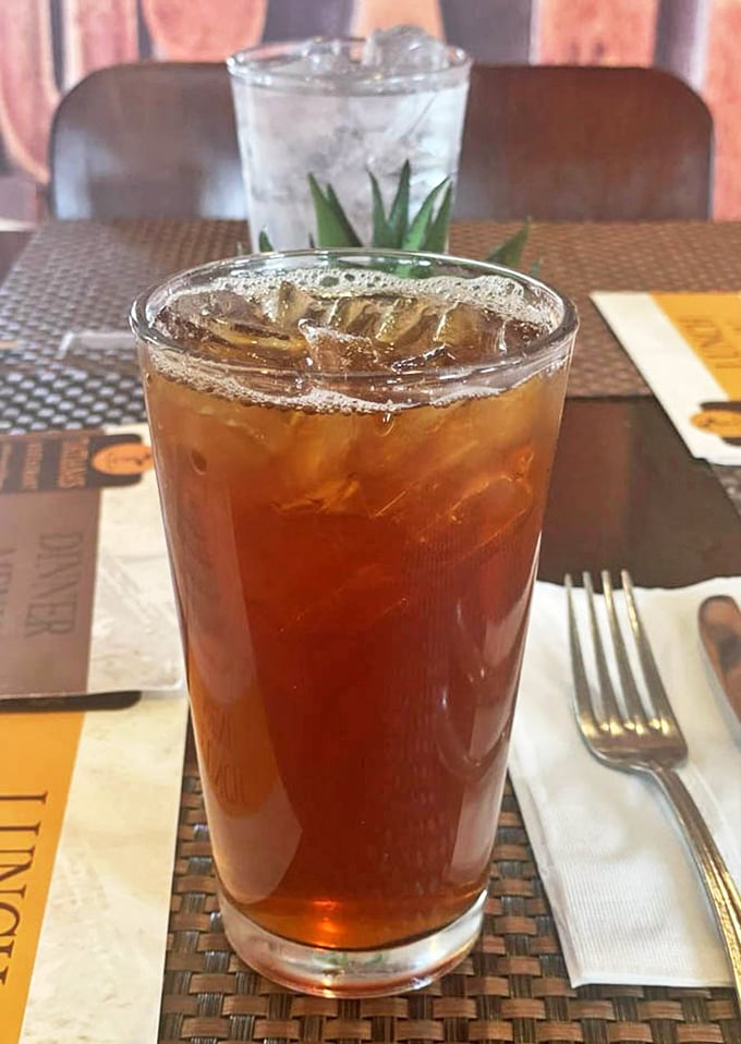 Even the iced tea looks like it's on vacation—amber liquid catching the light like it knows it's about to make your meal complete.