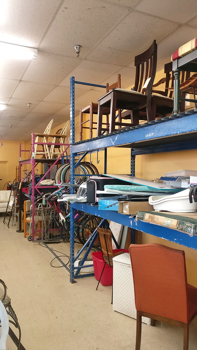Furniture tetris at its finest—chairs stacked to the ceiling like a modern art installation dedicated to "places to sit."