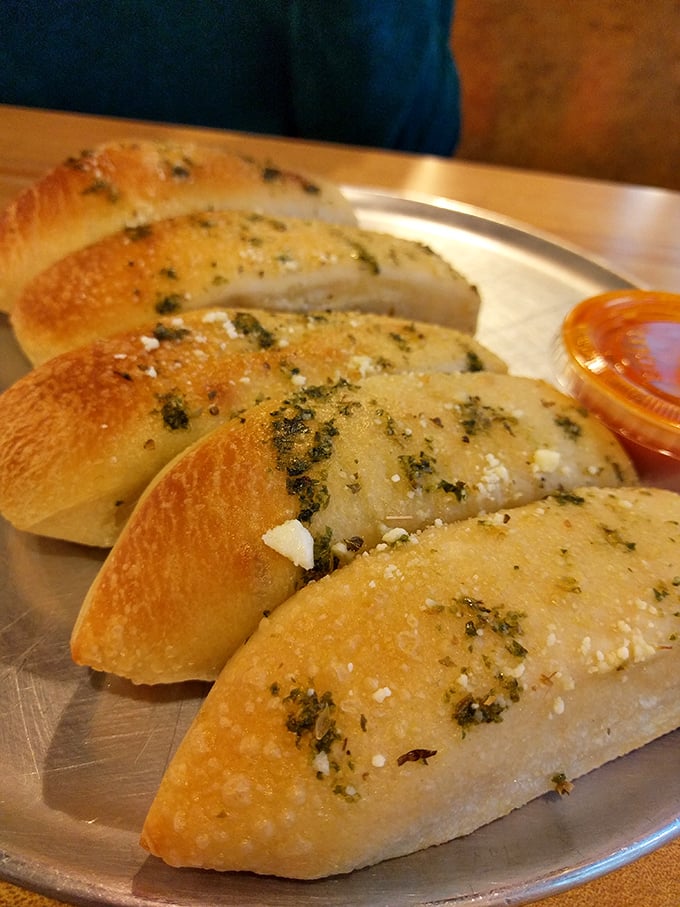 Garlic bread: humanity's greatest achievement since sliced bread itself. Golden, garlicky perfection that ruins first dates but elevates life.