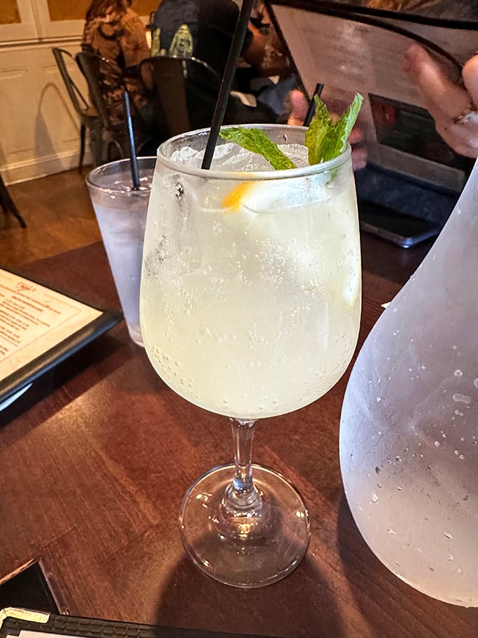 Clear as day but strong as night—a perfectly mixed gin and tonic with a sprig of mint is the ideal companion to pasta indulgence.