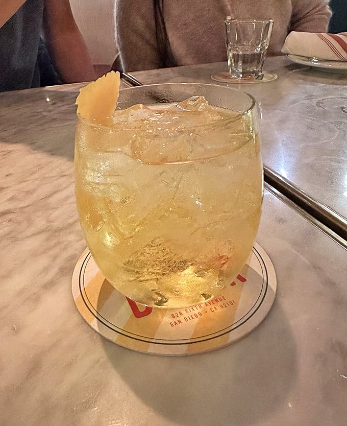 This isn't just a cocktail—it's a refreshing interlude between food adventures that cleanses your palate while making your Instagram followers jealous.
