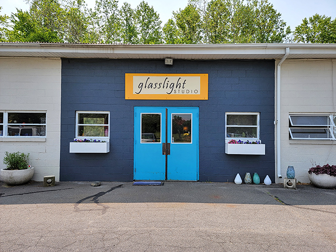 Glasslight Studio's vibrant blue doors promise artistic treasures within. It's like finding Tiffany's in Mayberry—unexpected but perfectly placed.