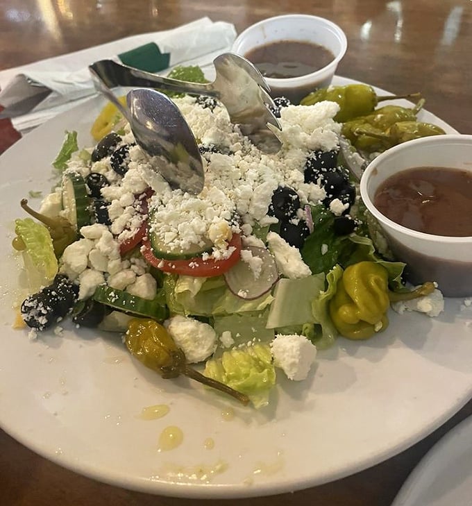 This isn't just a Greek salad—it's a Mediterranean vacation on a plate. Feta crumbles like little clouds over crisp vegetables and briny olives.