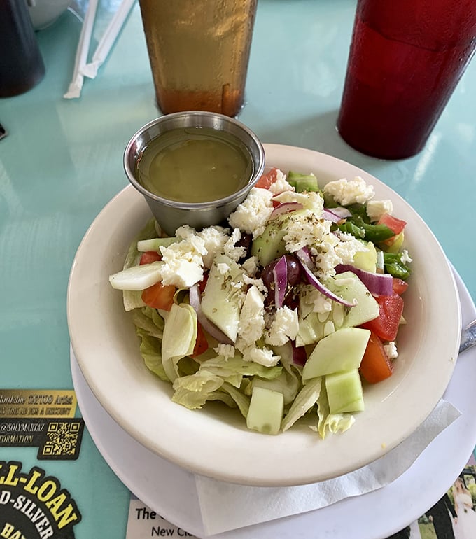 A Greek salad that actually looks like vegetables, not an afterthought. That feta isn't shy – it's the star of the show.