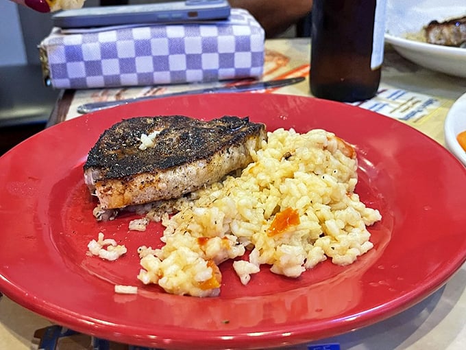 Perfectly blackened fish meets creamy risotto – a plate that would make both fishermen and fancy chefs nod in respectful approval.