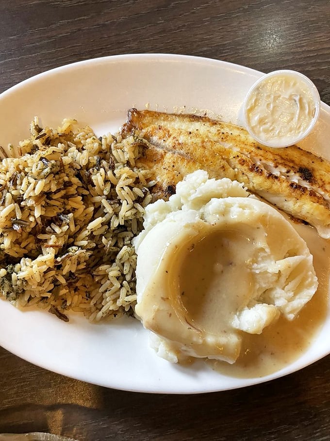 Perfectly grilled tilapia alongside wild rice and mashed potatoes. Proof that heartland cooking isn't just about meat and potatoes—though those shine too!