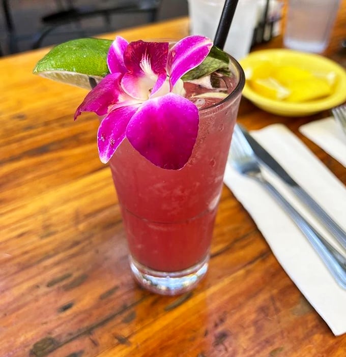 Not just a drink but a statement piece—this Hibiscus Coconut Mojito with its orchid garnish is Sacramento's most photogenic cocktail.