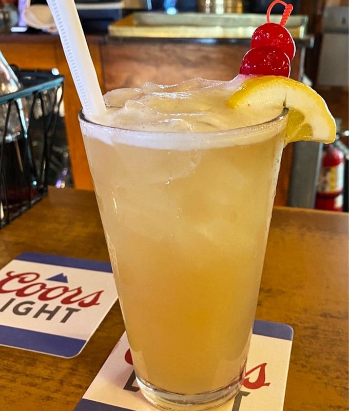 A refreshing "Hippie Juice" cocktail that brings sunshine in a glass—complete with cherries and lemon that aren't just garnishes but promises of the good times ahead.