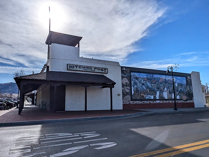 The Hitching Post Theater's mural-adorned exterior hints at the cultural offerings inside—proof that small towns can deliver big entertainment.