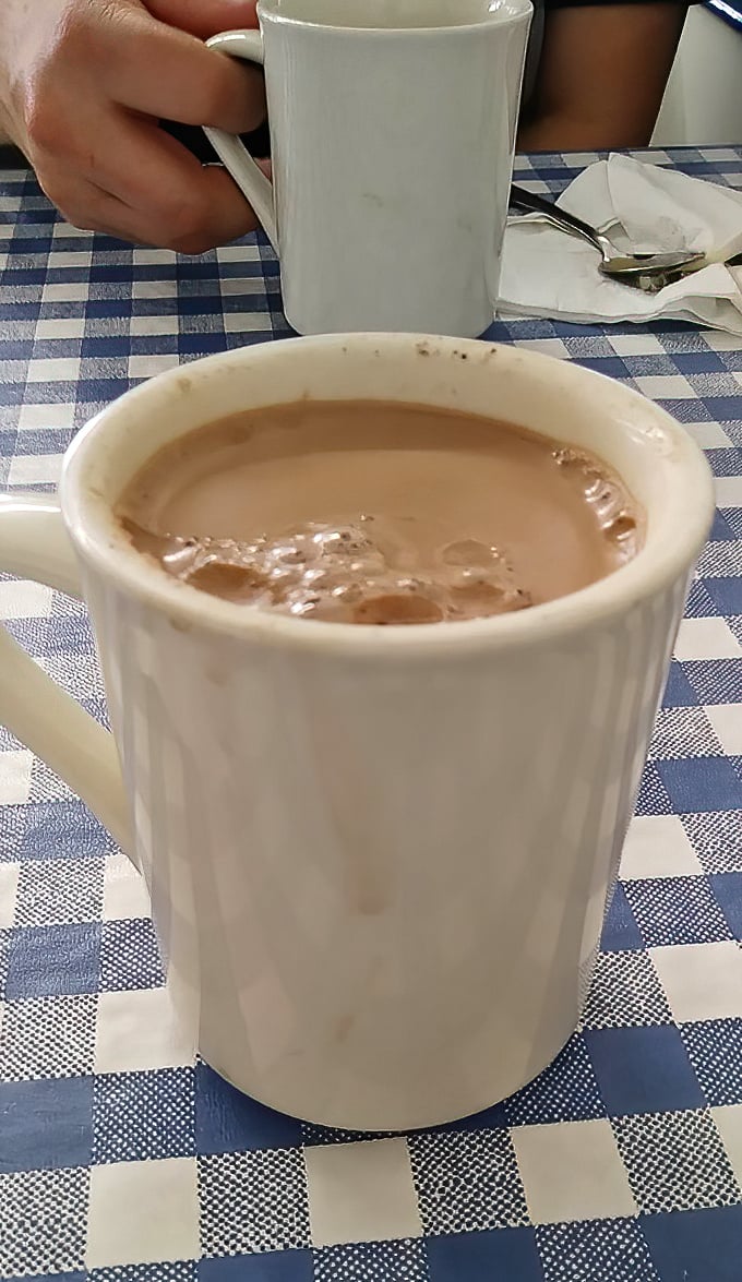 Coffee at Nick's comes in sturdy white mugs – the kind that say "I'm not here to be photographed, I'm here to wake you up."