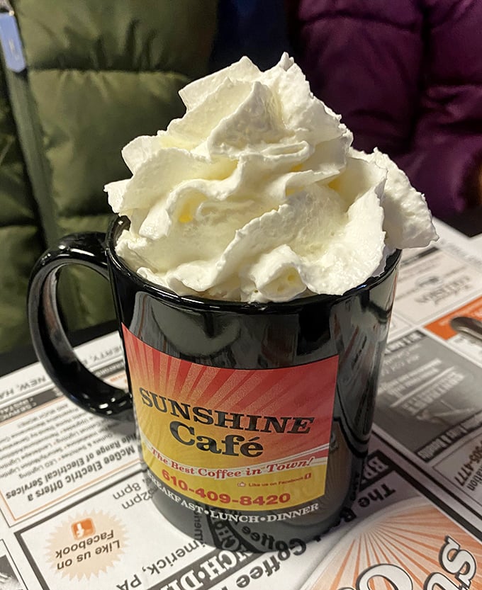 Hot chocolate that's more mountain than mug – whipped cream scaling heights that would intimidate seasoned alpinists.