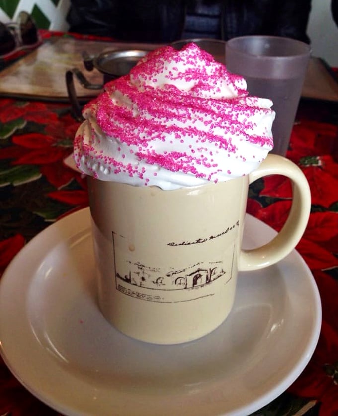 Hot chocolate that wears a pink crown of whipped cream—because sometimes your beverage deserves to dress fancy too.