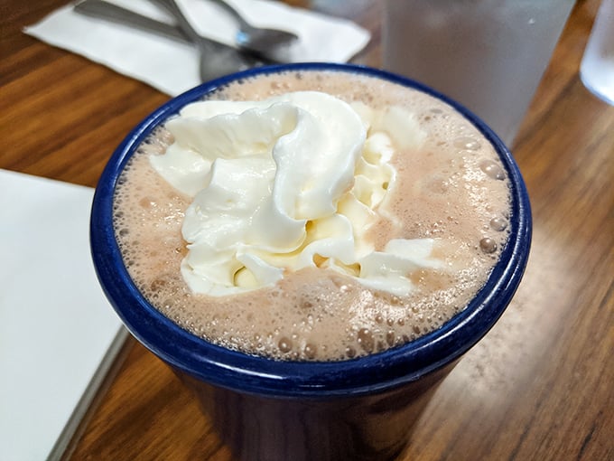 Hot chocolate that understands the Seattle weather. That mountain of whipped cream isn't excessive—it's necessary emotional support.