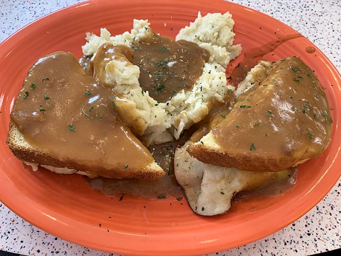 Comfort food doesn't get more comforting than this hot turkey sandwich—bread islands in a gravy sea with mashed potato mountains. Thanksgiving without the family drama! 