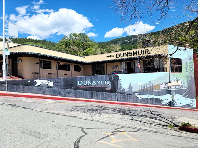Hotel Dunsmuir stands ready for weary travelers, its vintage charm and mountain mural promising adventures that don't require scrolling or Wi-Fi.