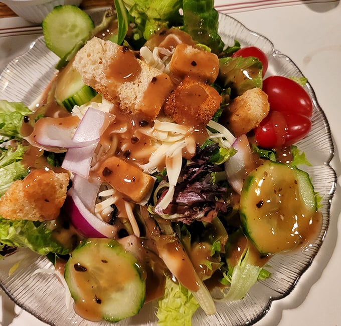 Even the house salad refuses to be ordinary—crisp vegetables, homemade croutons, and a dressing that makes you wonder why you'd ever buy bottled again.