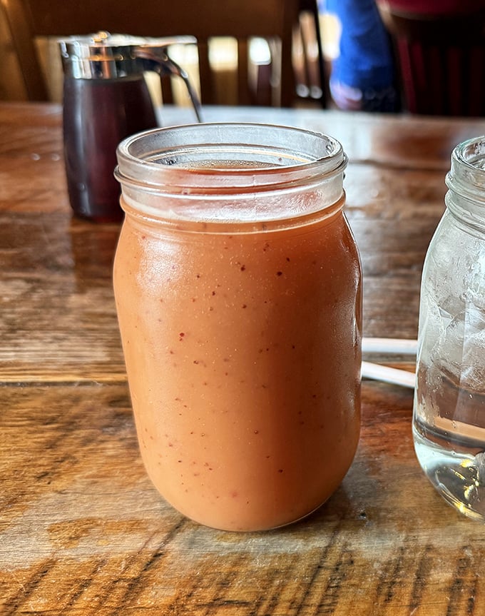 Served in a mason jar because, well, Tennessee. This sunrise-colored smoothie might be the only healthy choice you'll make here—and worth every sip.