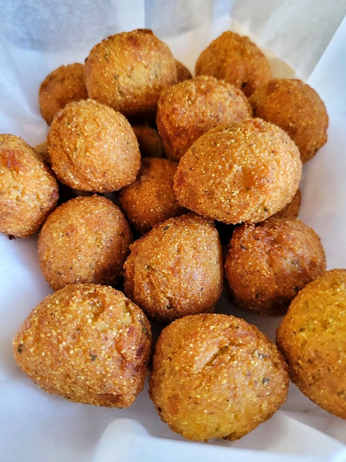These golden hush puppies emerge from the fryer like little spheres of Southern comfort perfection.