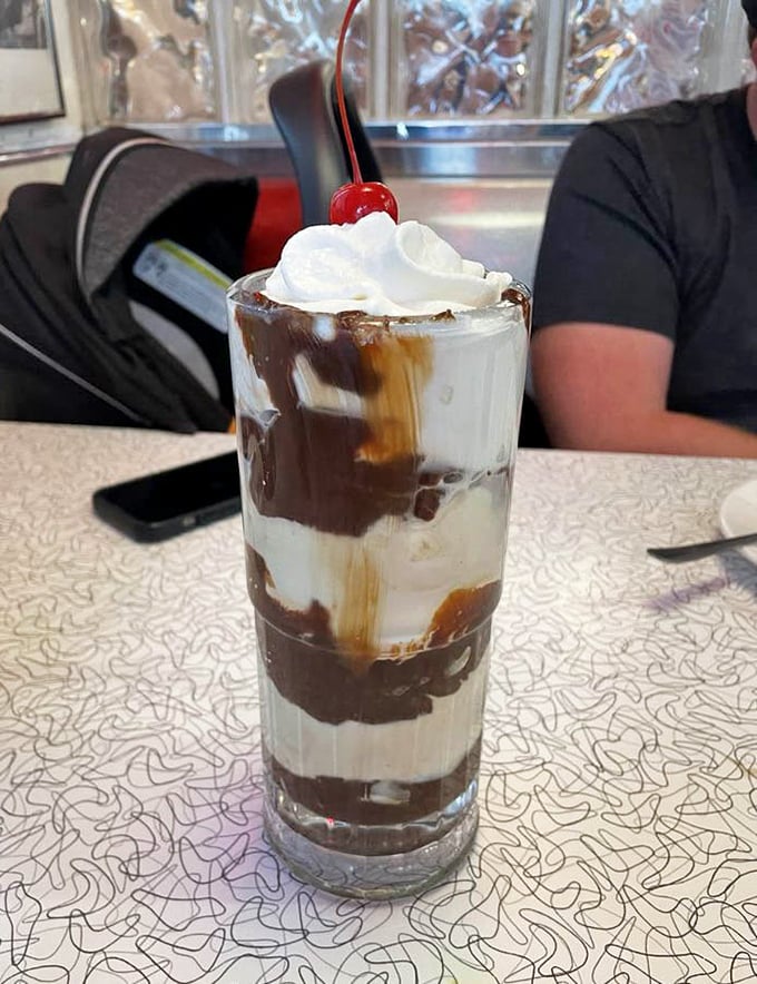 Layers of chocolate and vanilla create the perfect parfait—like geological strata of deliciousness topped with a cloud of whipped cream.