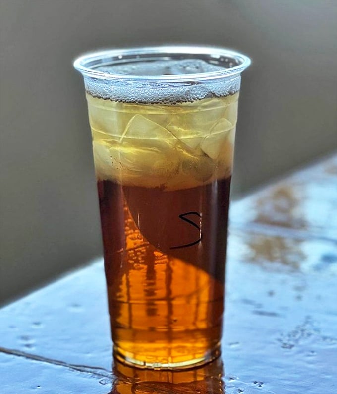 Sweet tea so perfectly layered it resembles a Florida sunset—the kind of drink that makes you want to sit a spell.