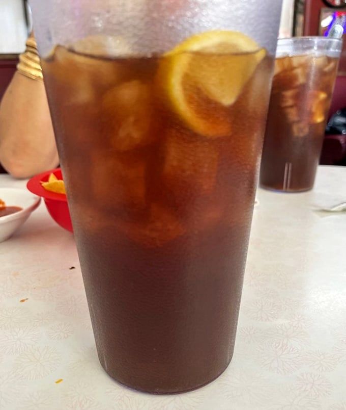 Sweet tea served in a no-nonsense glass with a lemon wedge—the unofficial hydration station of the Southwest, condensation beading like desert morning dew.