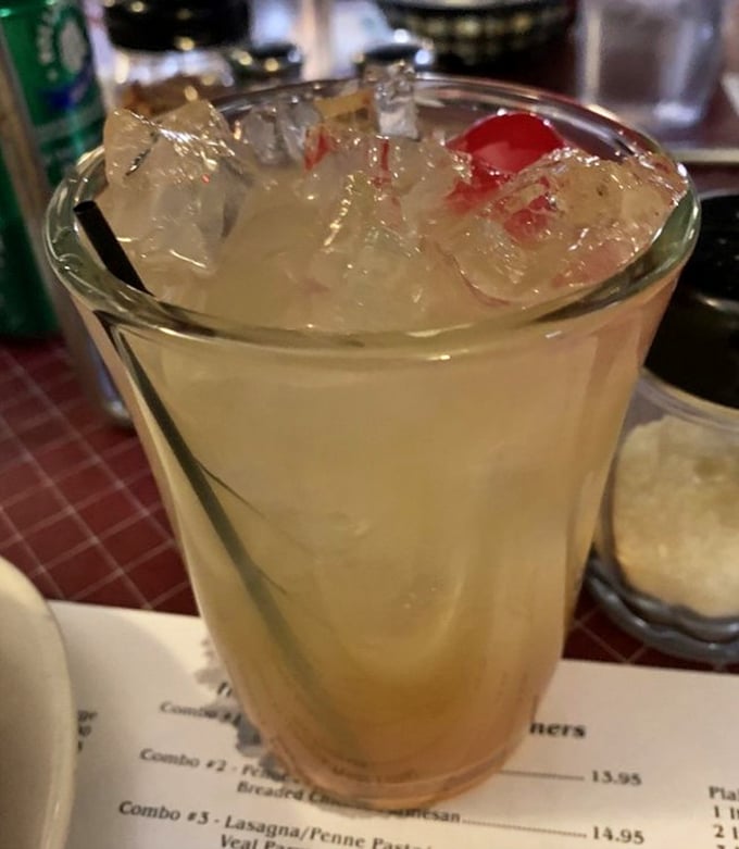 This isn't just a drink—it's a vacation in a glass, offering a moment of refreshment between bites of garlicky, cheesy goodness.