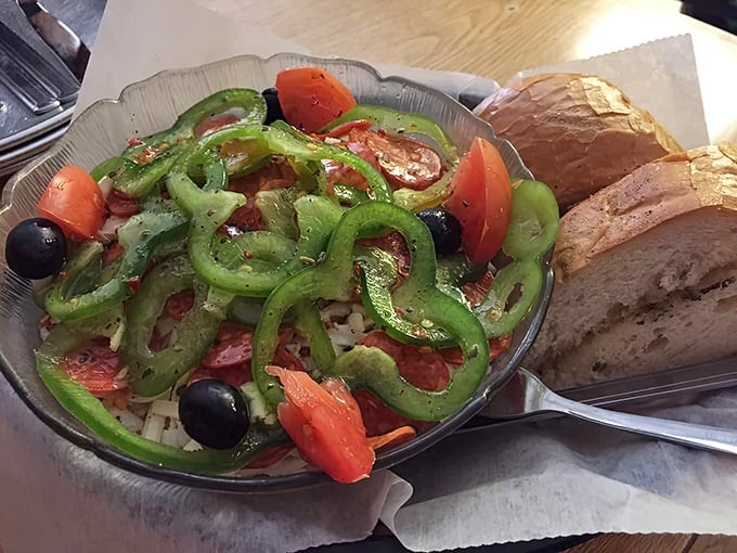 A vibrant Italian salad that somehow makes vegetables exciting. Those green peppers and olives are playing jazz while the tomatoes keep the beat.