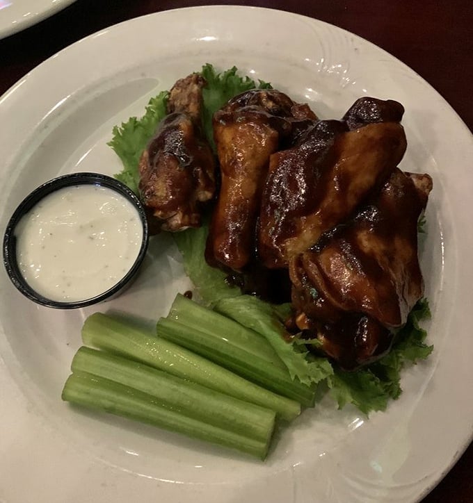 These wings aren't just cooked—they're transformed by Kentucky bourbon into something that makes vegetarians question their life choices.