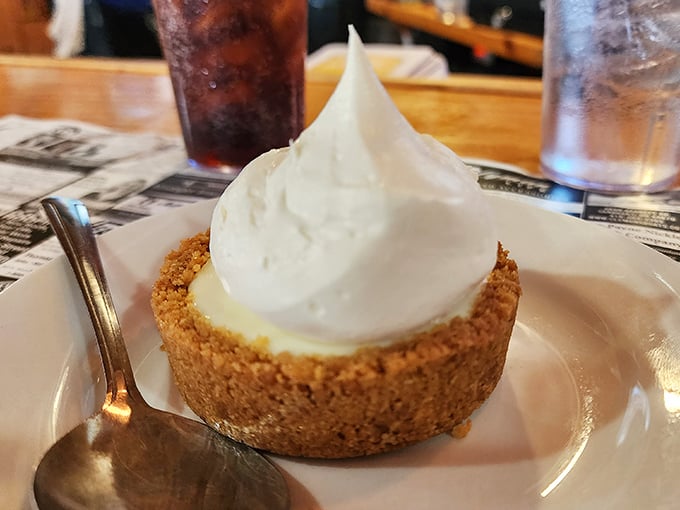 Key lime pie that strikes that magical balance between sweet and tart, topped with a cloud of whipped cream that's practically begging for your spoon.
