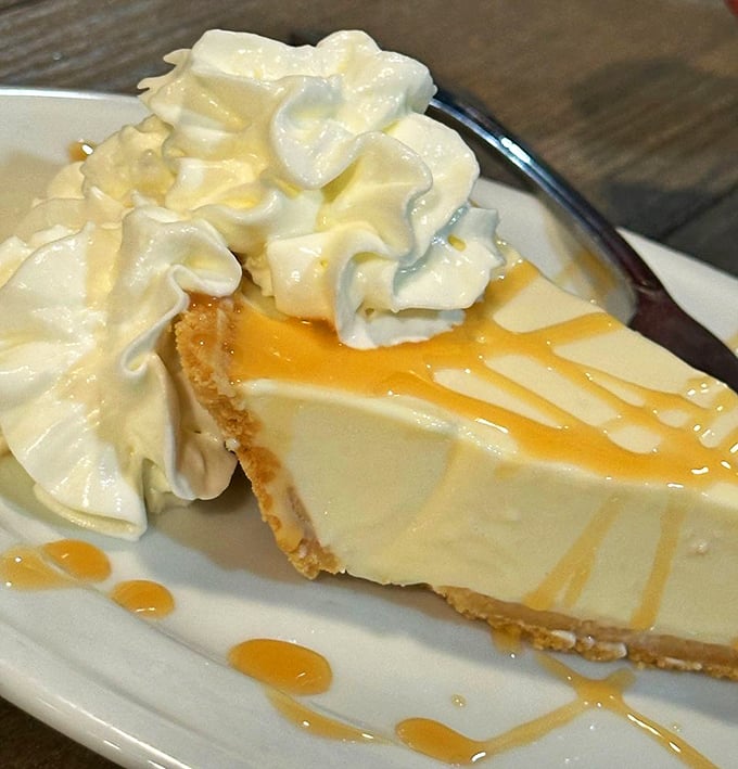 Key lime pie that captures Florida's essence in one perfect, tangy-sweet slice topped with clouds of whipped cream dreams.