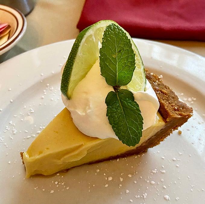 Key lime pie gets the California treatment with a generous dollop of whipped cream and fresh mint. The perfect sweet-tart finale to a meal built on smoke and fire.