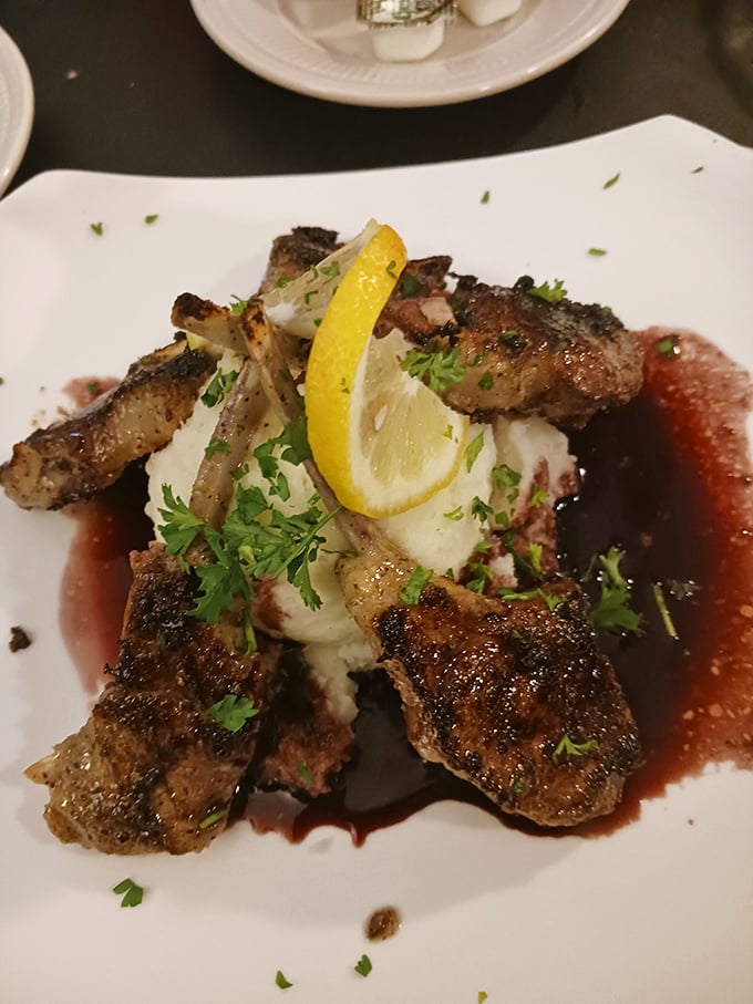 Lamb chops arranged like a crown around mashed potatoes—because sometimes dinner deserves to wear royal regalia.
