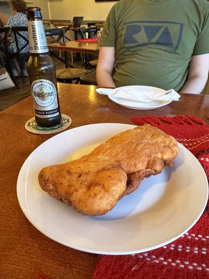 A German pilsner alongside what appears to be langosh—fried dough that's like the Eastern European cousin to funnel cake, only better.