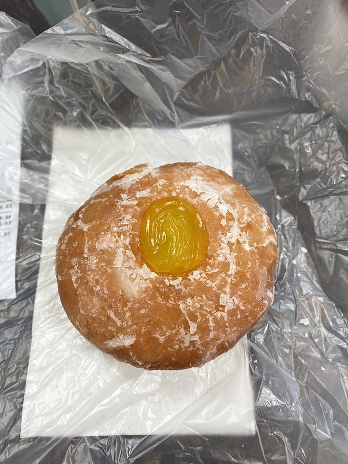 The powdered sugar donut with lemon filling offers that perfect sweet-tart balance – like finding the ideal dance partner who knows all your moves.