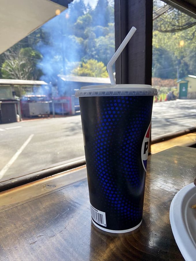 Through that window, you can see smoke rising from the grills outside – visual evidence that good things come to those willing to wait.
