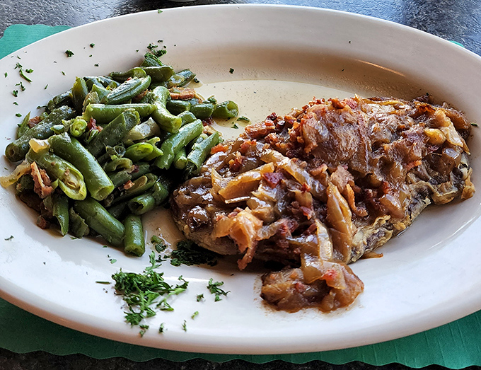 Comfort food done right—tender meat with caramelized onions and fresh green beans that your grandmother would approve of.