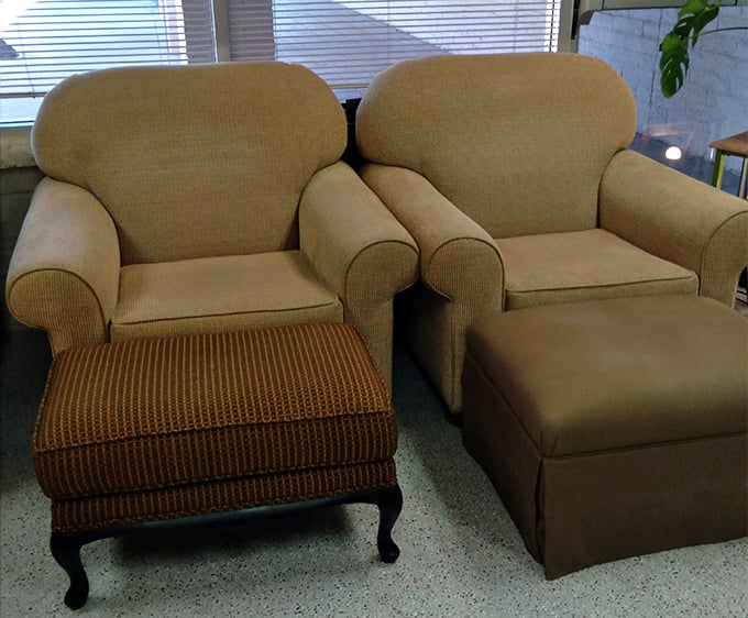 Matching armchairs begging to become someone's favorite reading nook for afternoon coffee and contemplation.